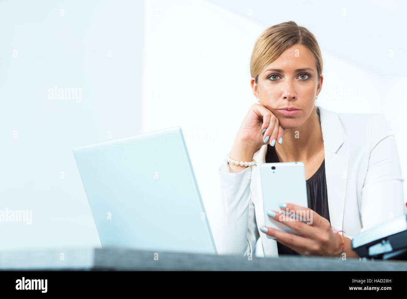 intense look of a determined woman aware of her wide communications ...