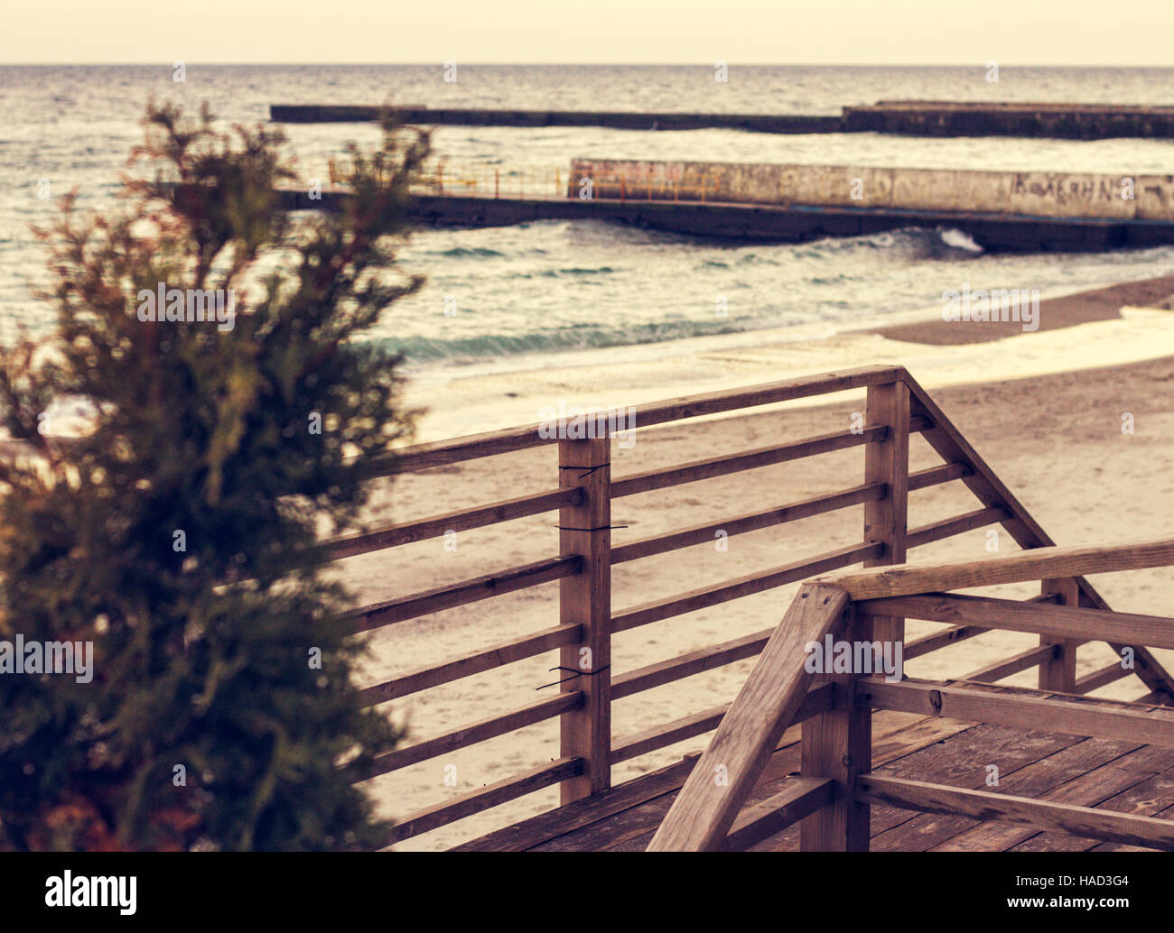 wooden ladder with railings on the beach during warm sunset Stock Photo ...