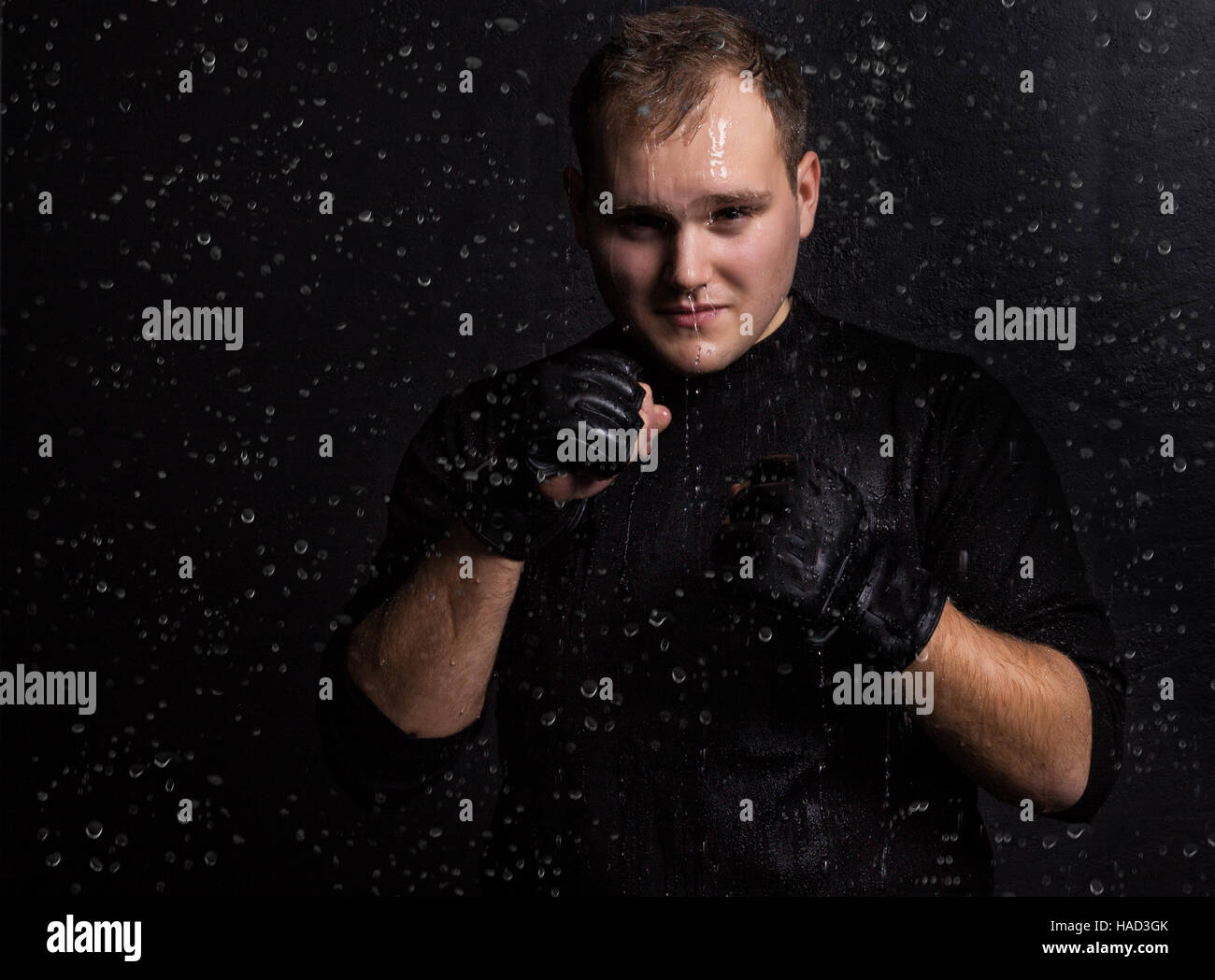 Portrait of boxer fighting in the rain in aquastudio with drops Stock ...