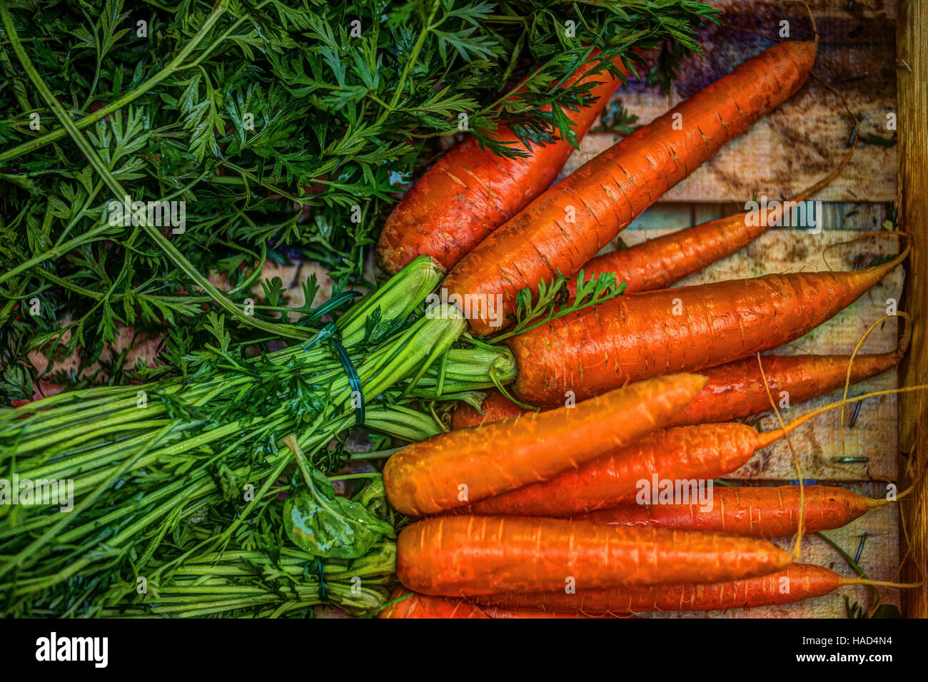 Fresh carrots bunch in the wooden box Stock Photo - Alamy
