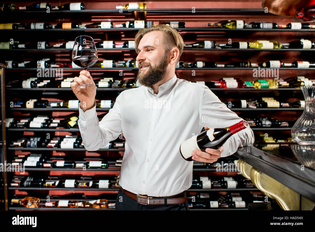 Male sommelier checking wine hi-res stock photography and images - Alamy