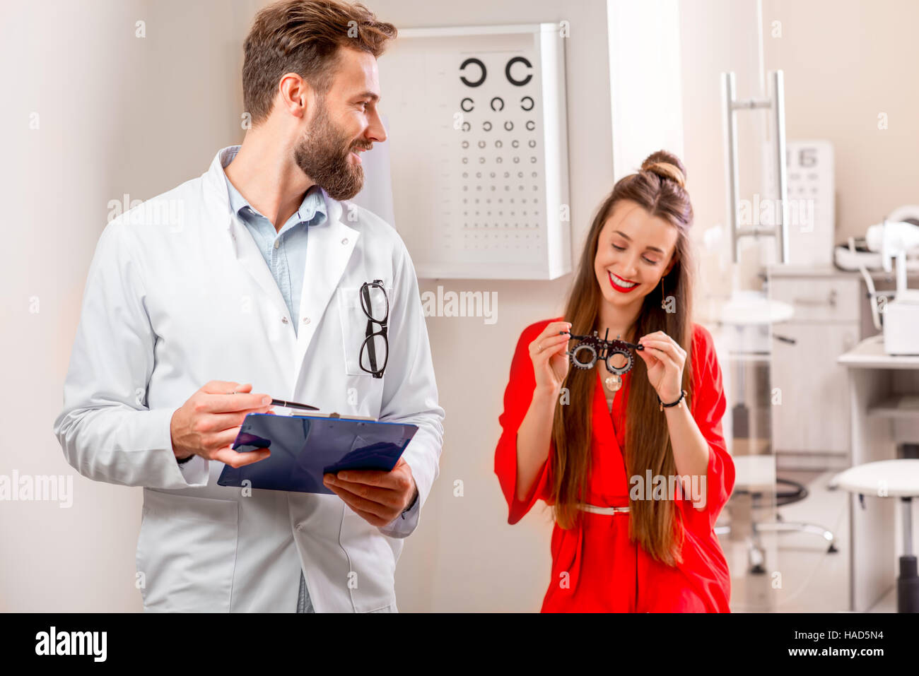 Eye doctor with patient Stock Photo - Alamy