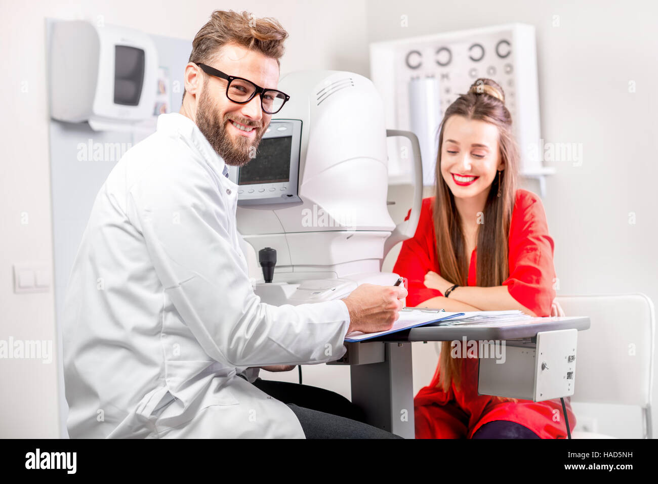 Eye doctor with patient Stock Photo - Alamy