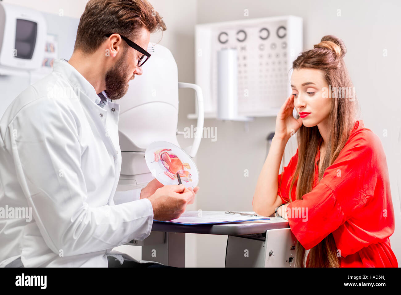 Eye doctor with patient Stock Photo - Alamy