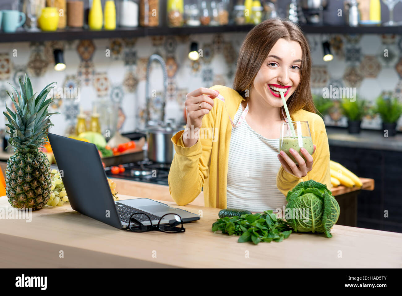 Woman drinking smoothie Stock Photo - Alamy