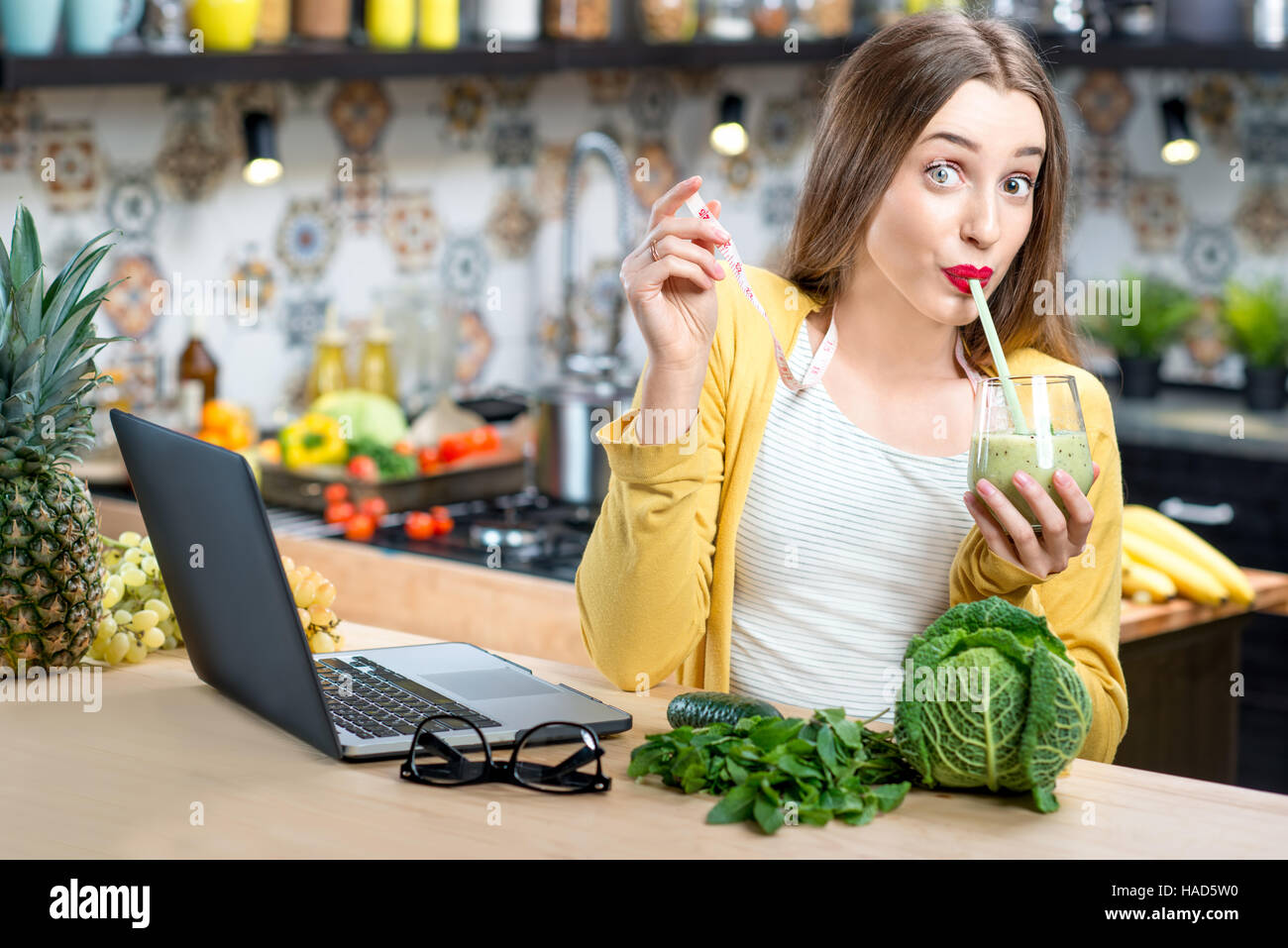 Woman drinking smoothie Stock Photo - Alamy