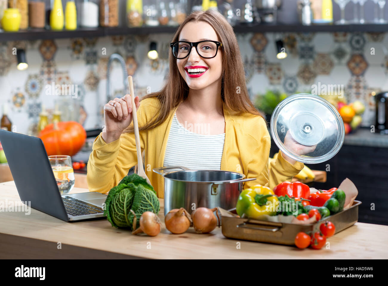 Woman in the kitchen Stock Photo - Alamy