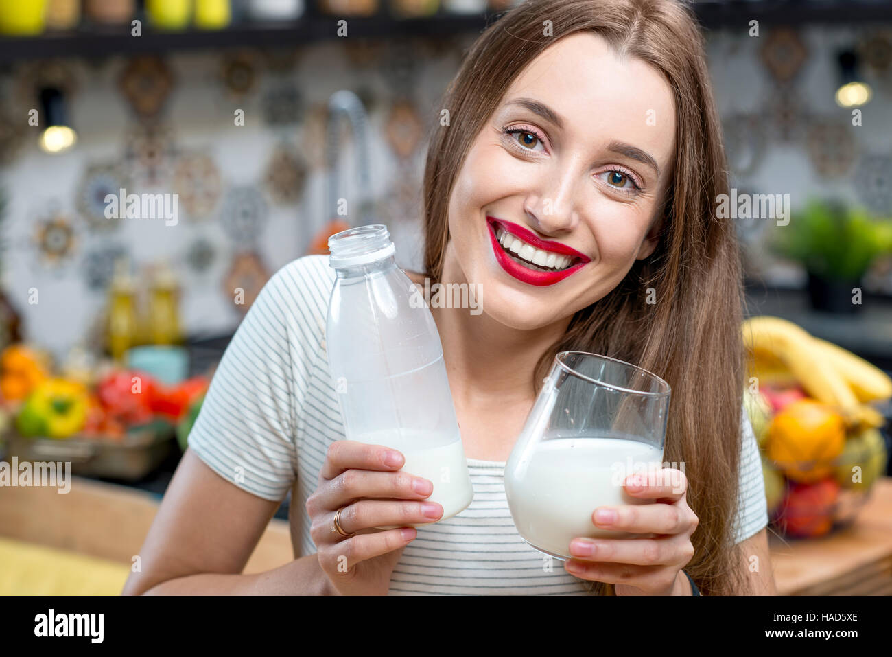 Happy young woman glass milk hi-res stock photography and images - Alamy
