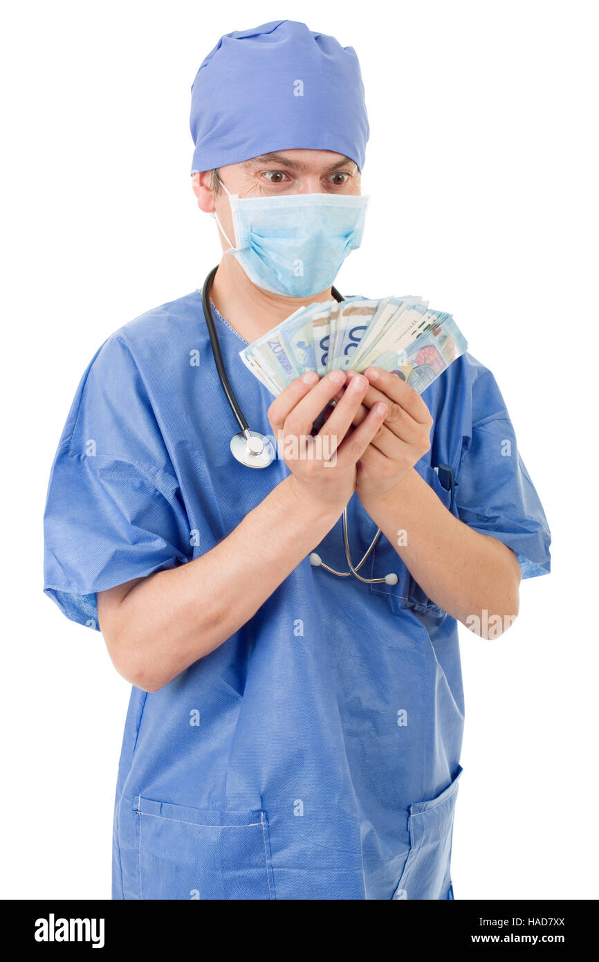Happy male doctor holding bank notes, isolated Stock Photo - Alamy