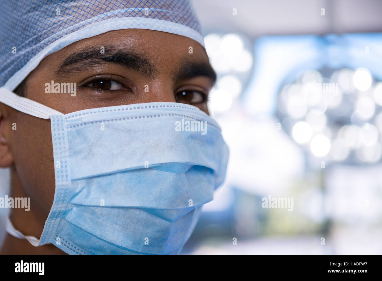 Portrait of surgeon standing in operation room Stock Photo - Alamy