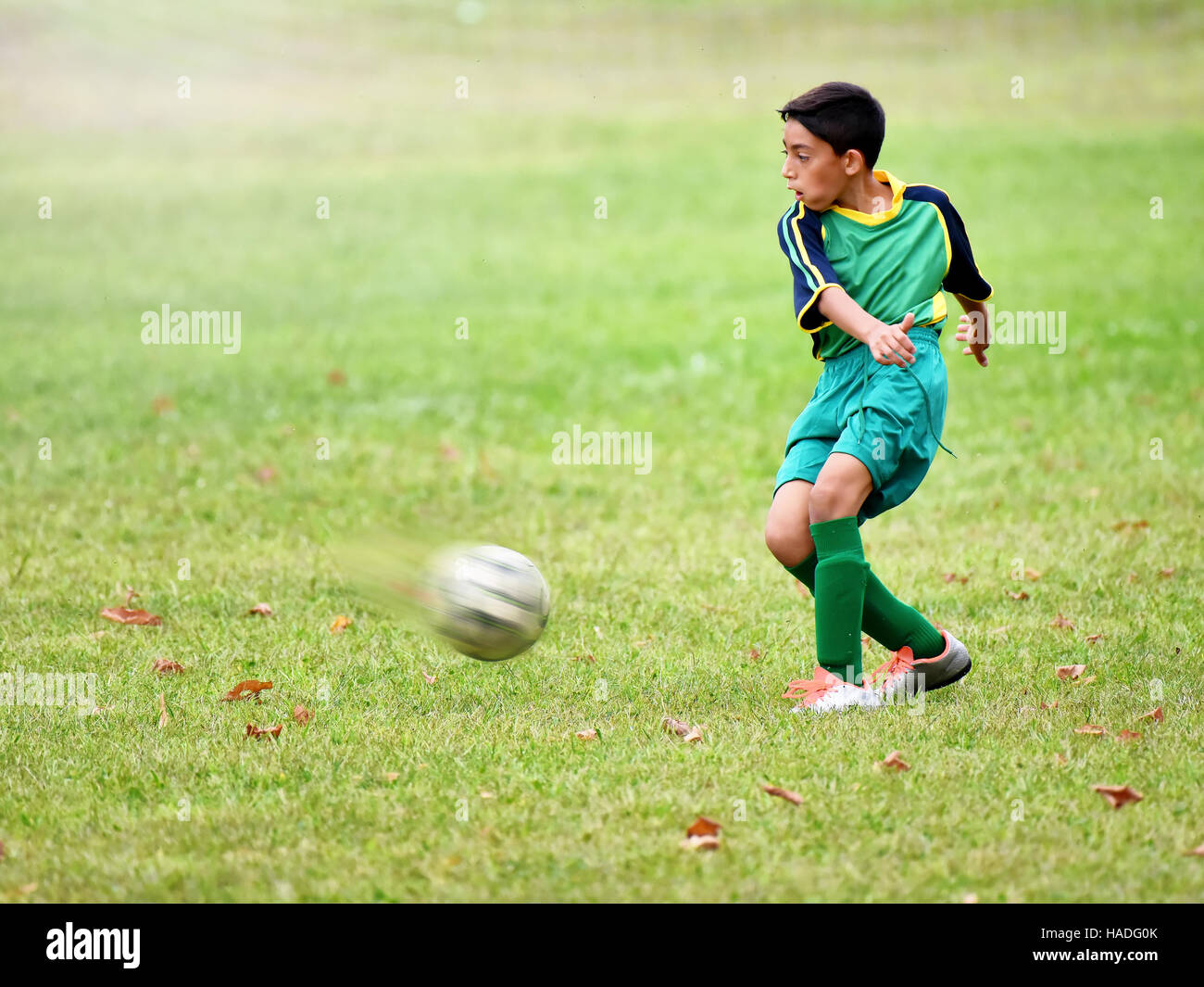 young boy playing soccer Stock Photo - Alamy