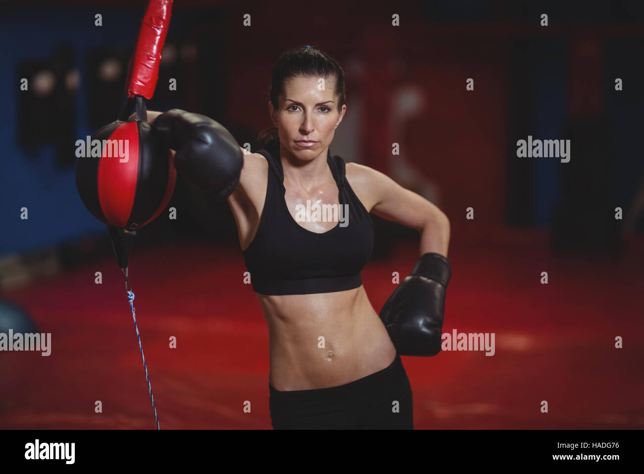 Female boxer leaning on speed boxing ball Stock Photo - Alamy