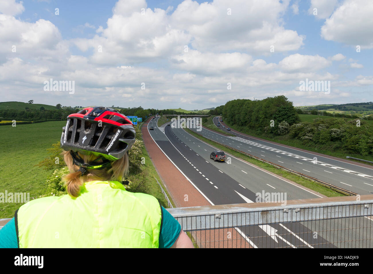 Cyclist Looking Down onto the M6 Motorway from a Section of the Lakes ...