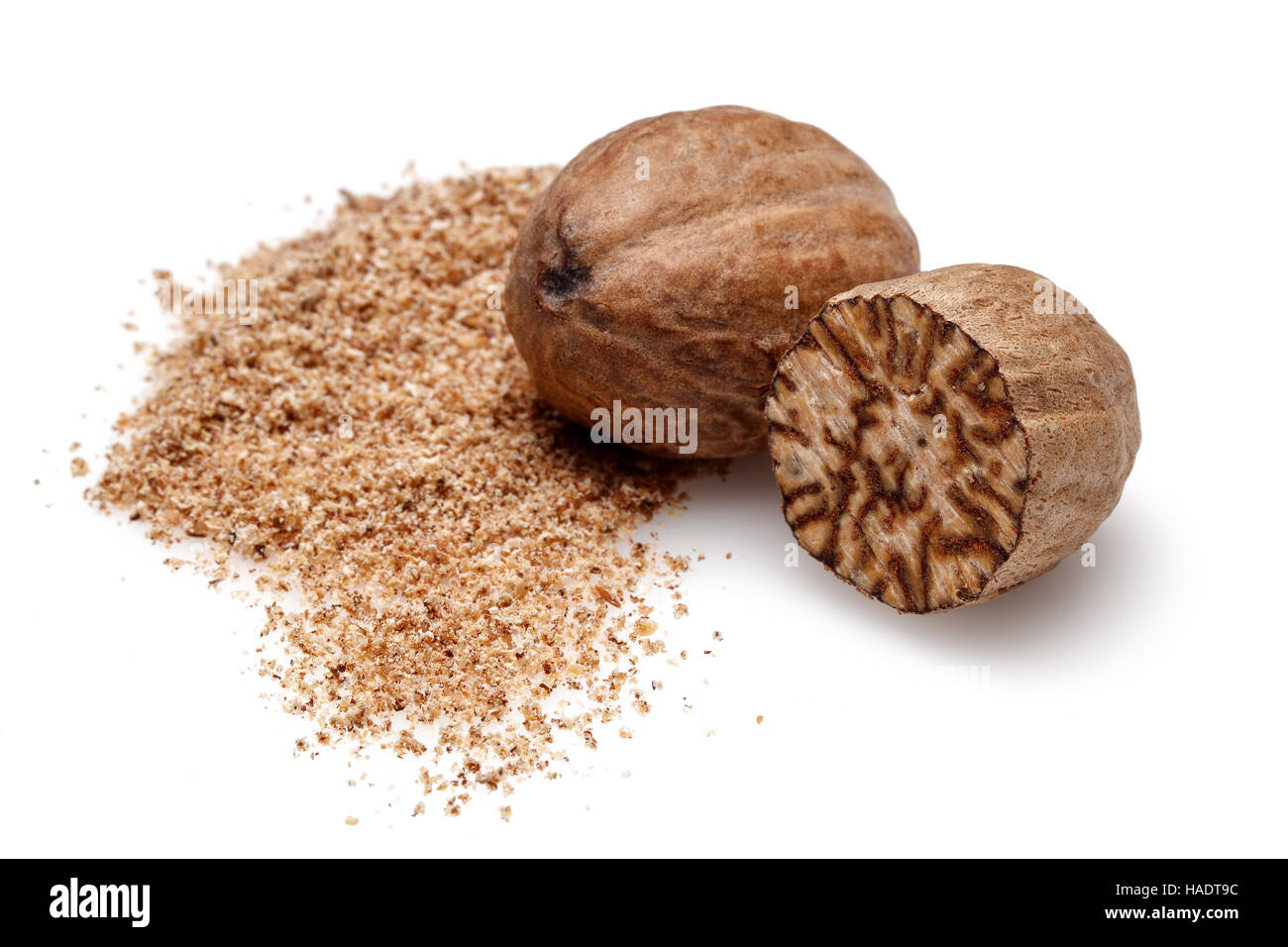 Nutmeg and ground nutmeg on white background Stock Photo - Alamy
