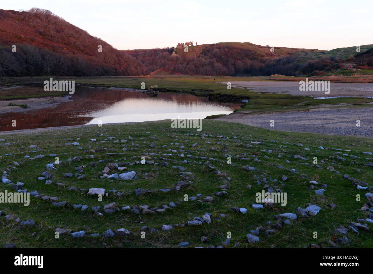 Beach sculpture,Three cliffs bay, Gower, Wales at sunset . with Pennard ...