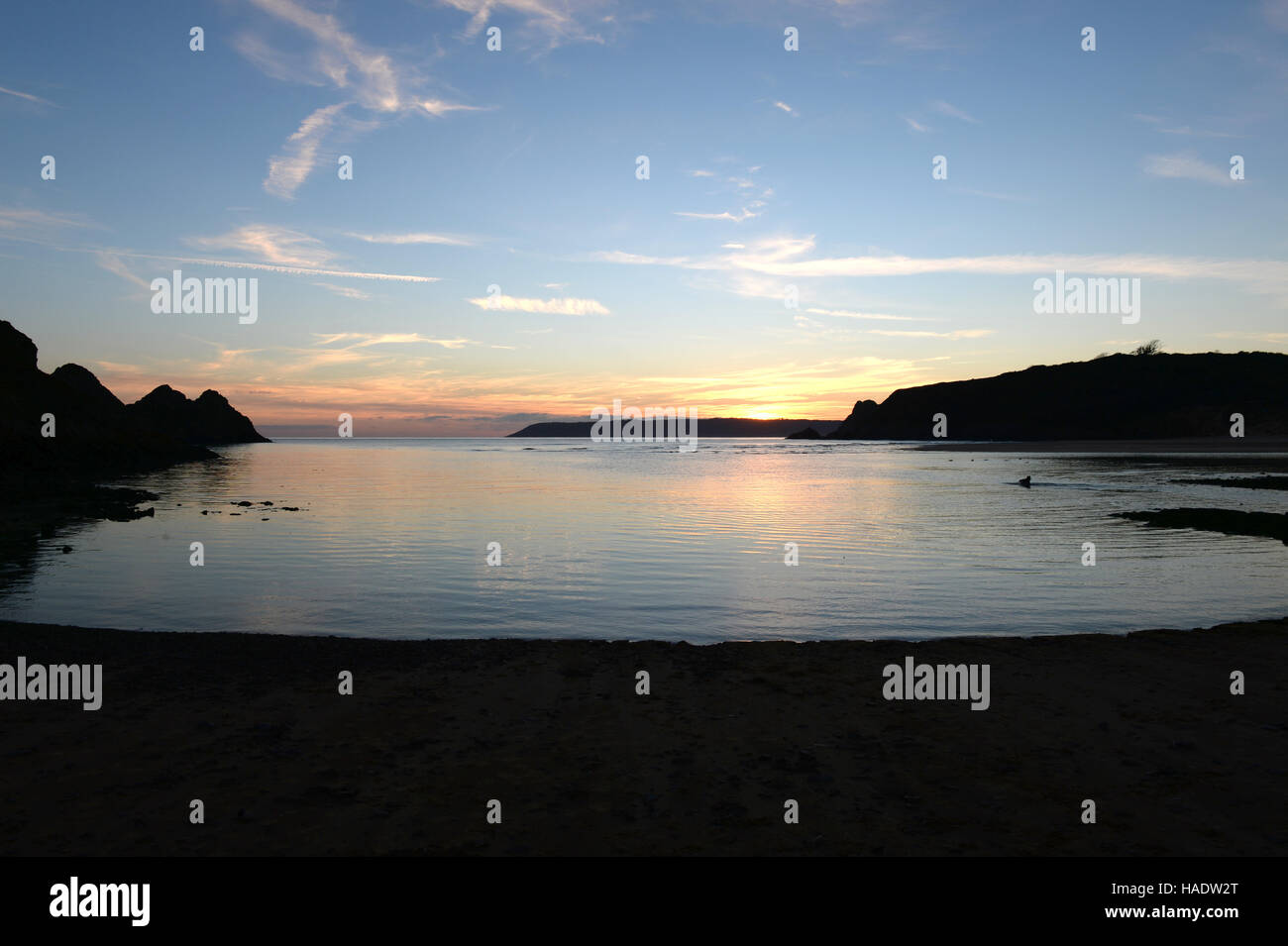 Three cliffs bay, Gower, Wales at sunset . A high tide fills the valley ...