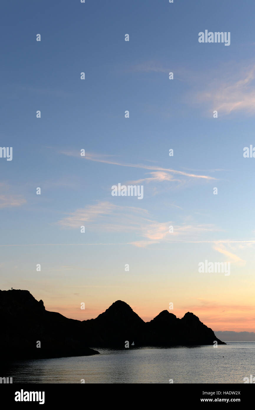 Three cliffs bay, Gower, Wales at sunset with light shining through the ...