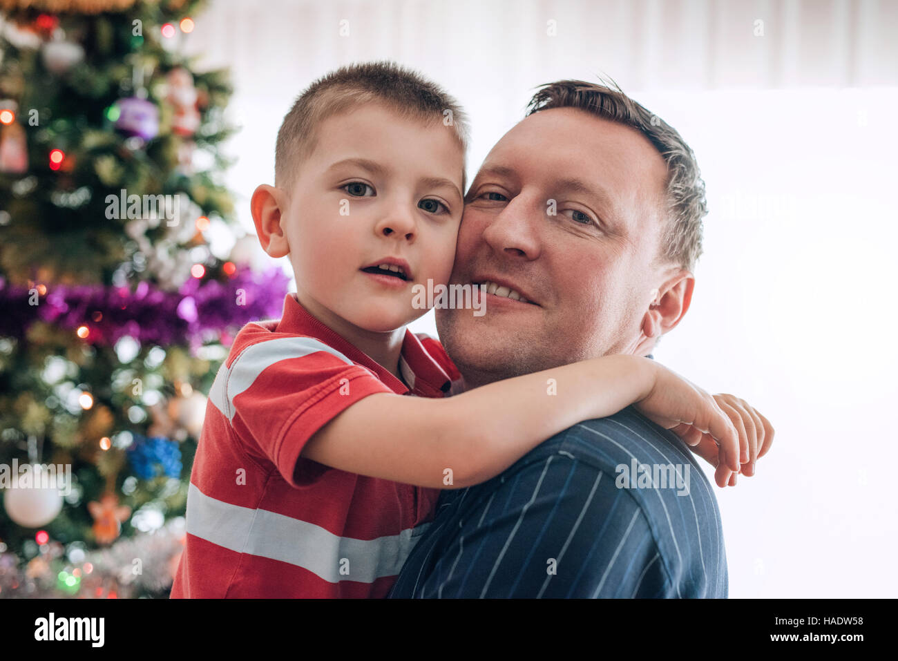 Smiling father and son at christmas Stock Photo - Alamy