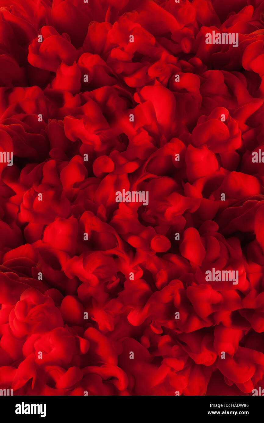 Closeup of the red ink explosion in water Stock Photo - Alamy