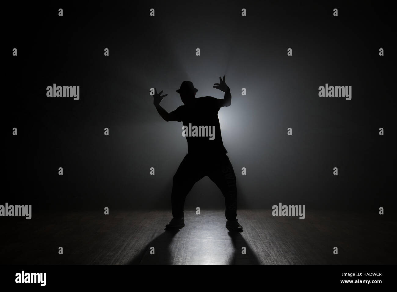 Dancer posing backlit Stock Photo - Alamy
