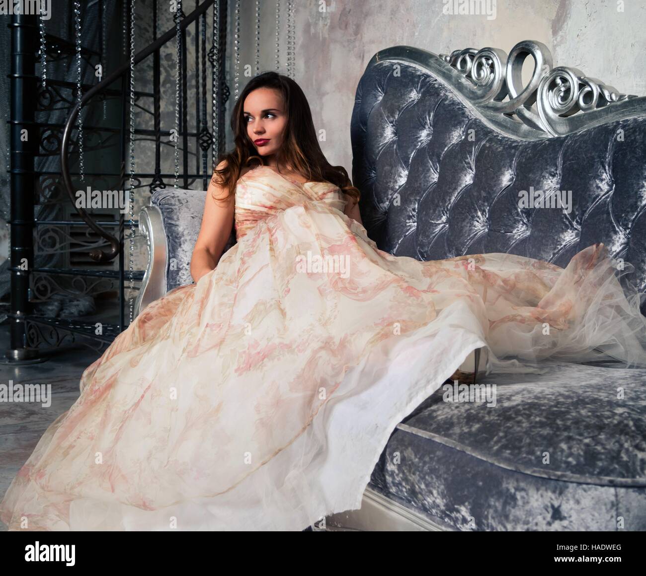 Woman in dress relaxing and lying down Stock Photo - Alamy