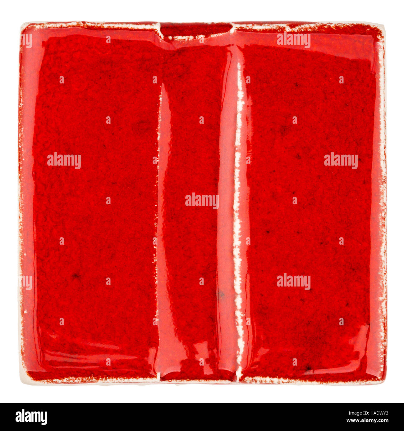 Red lined handmade glazed ceramic tile isolated on white background ...