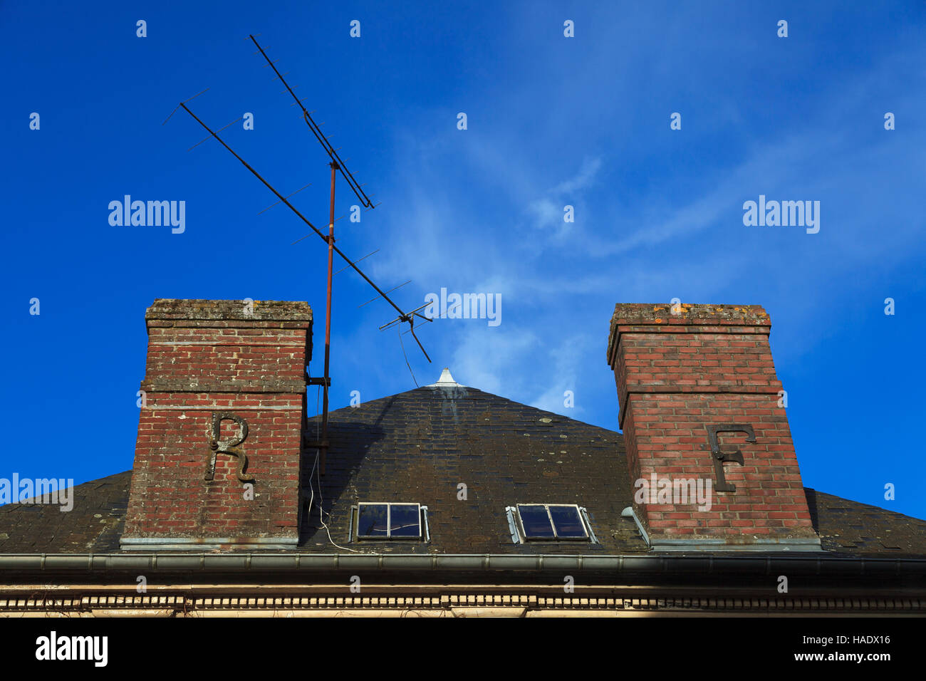 A pair of French chimneys decorated with an "R" and "F" as an ...