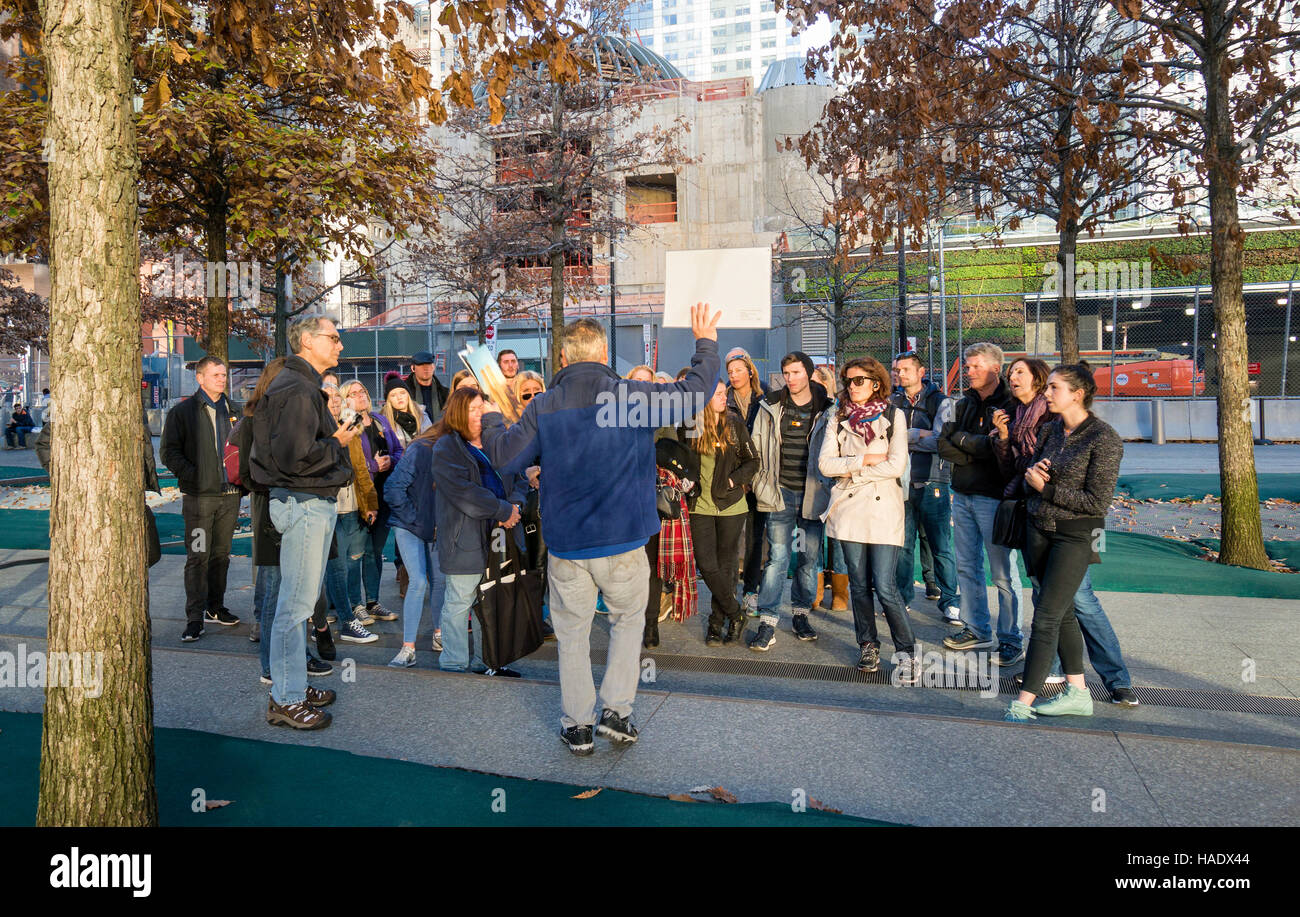 A tour guide lecturing a tour group on the events of 911 Stock Photo ...