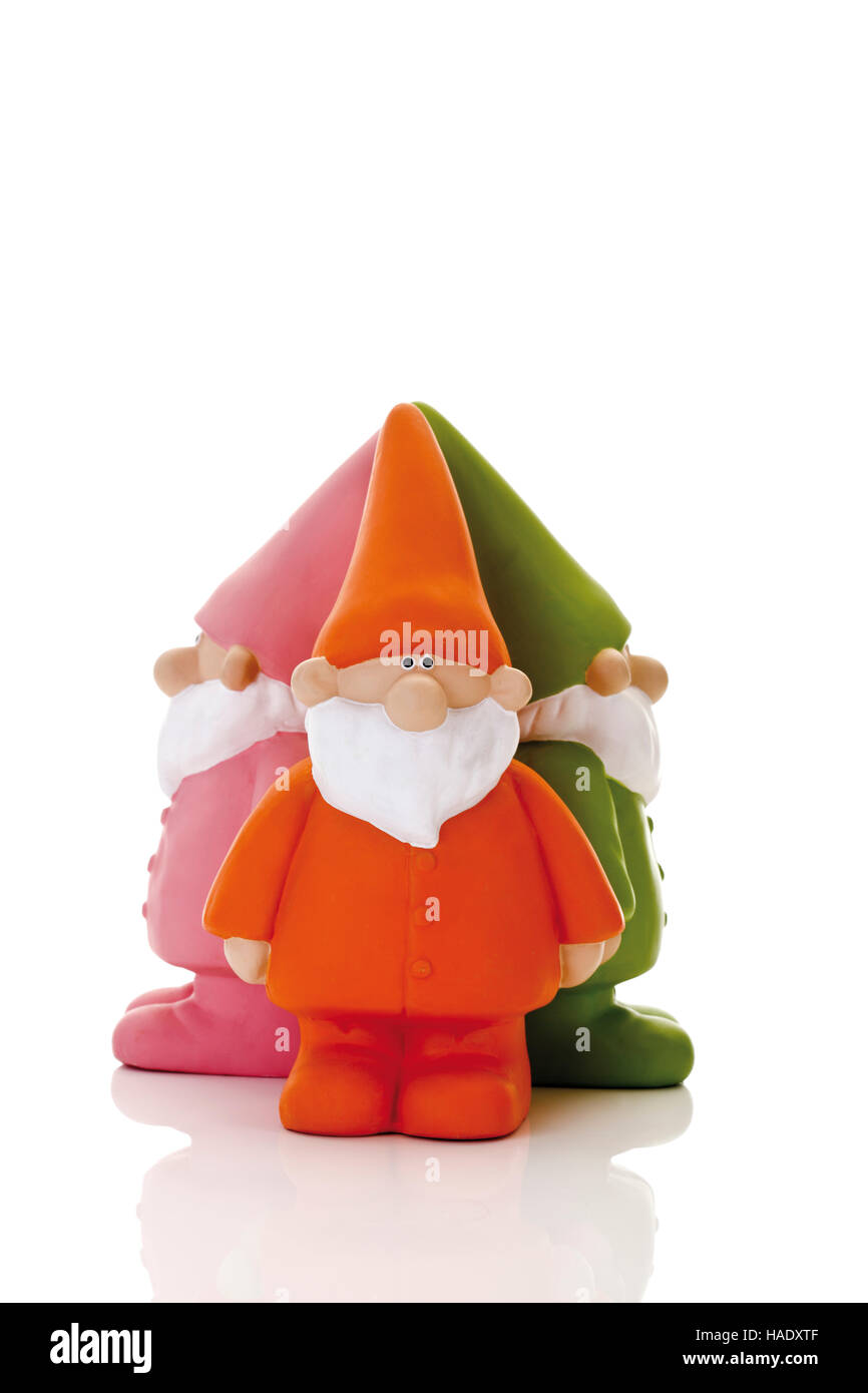 Three garden gnomes standing back to back Stock Photo - Alamy