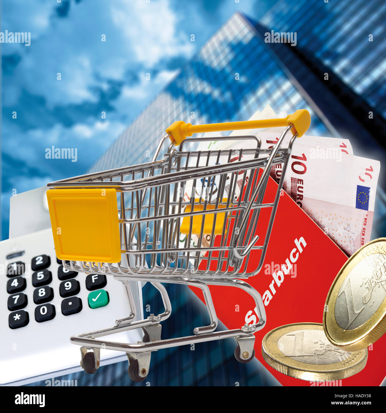 Shopping trolley, savings book, euro banknotes, euro coins, card ...
