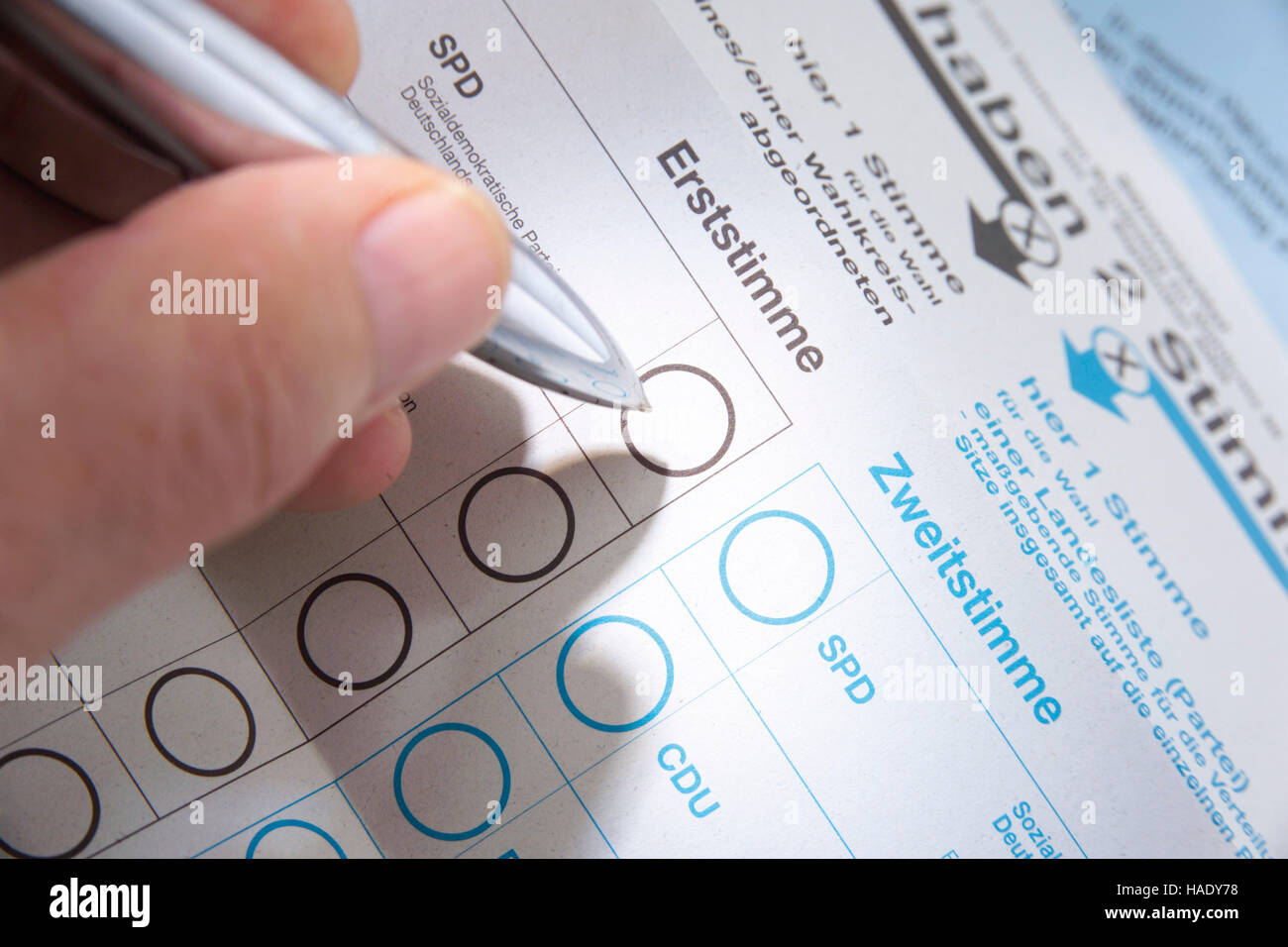 Ballot paper, hand with pen Stock Photo - Alamy