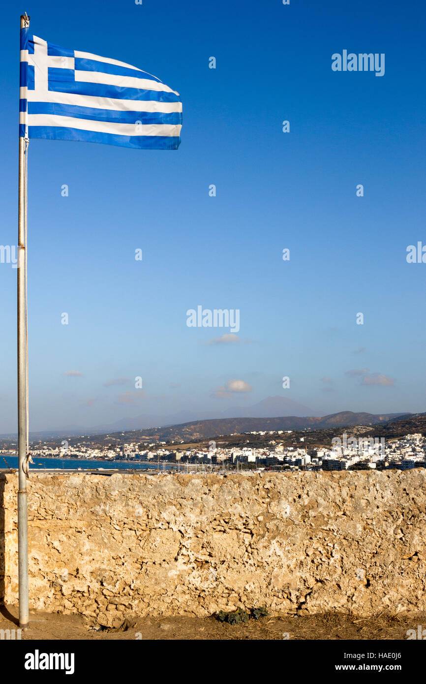 Greek flag flying in the Fortezza ruins above the coastal city of ...