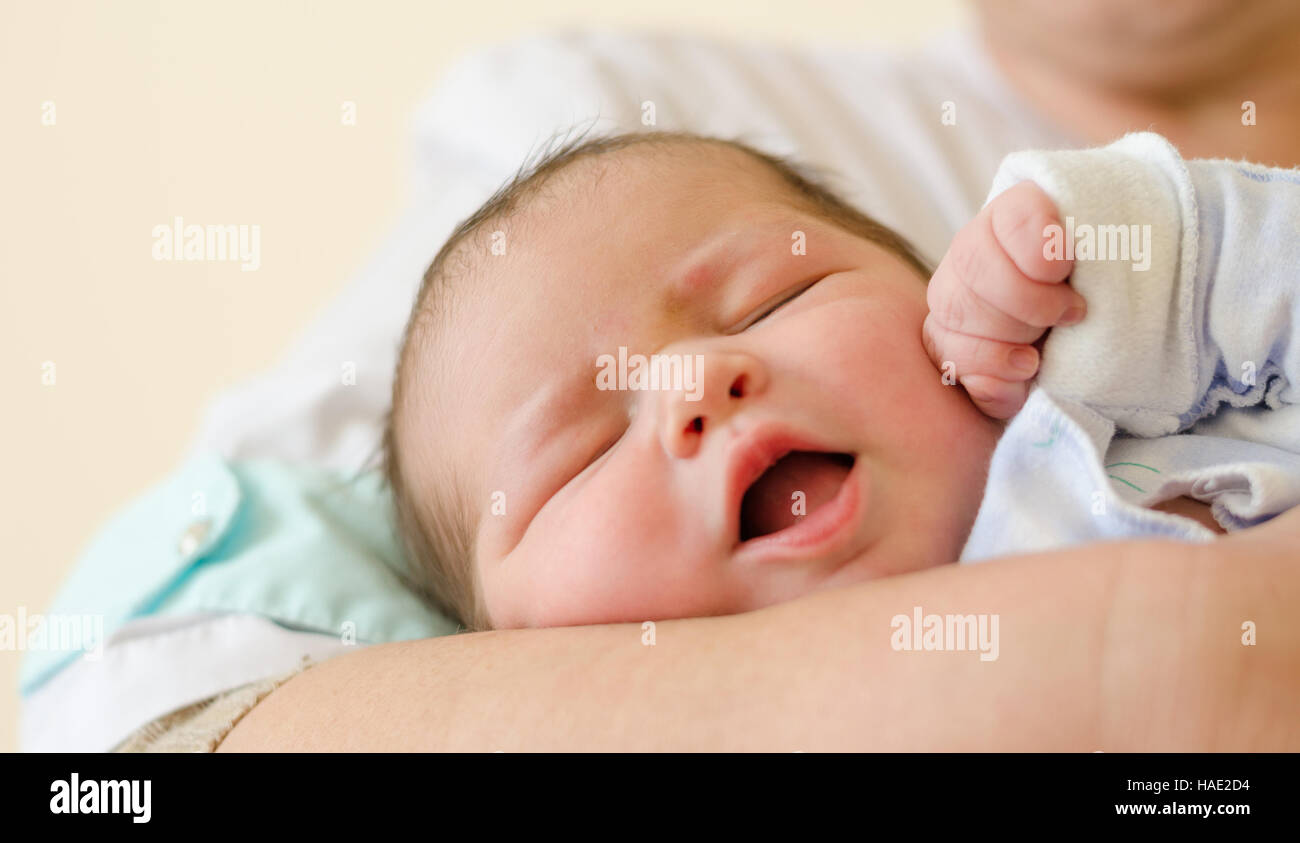 Newborn baby in the hands of the obstetrician. Soft focus Stock Photo ...