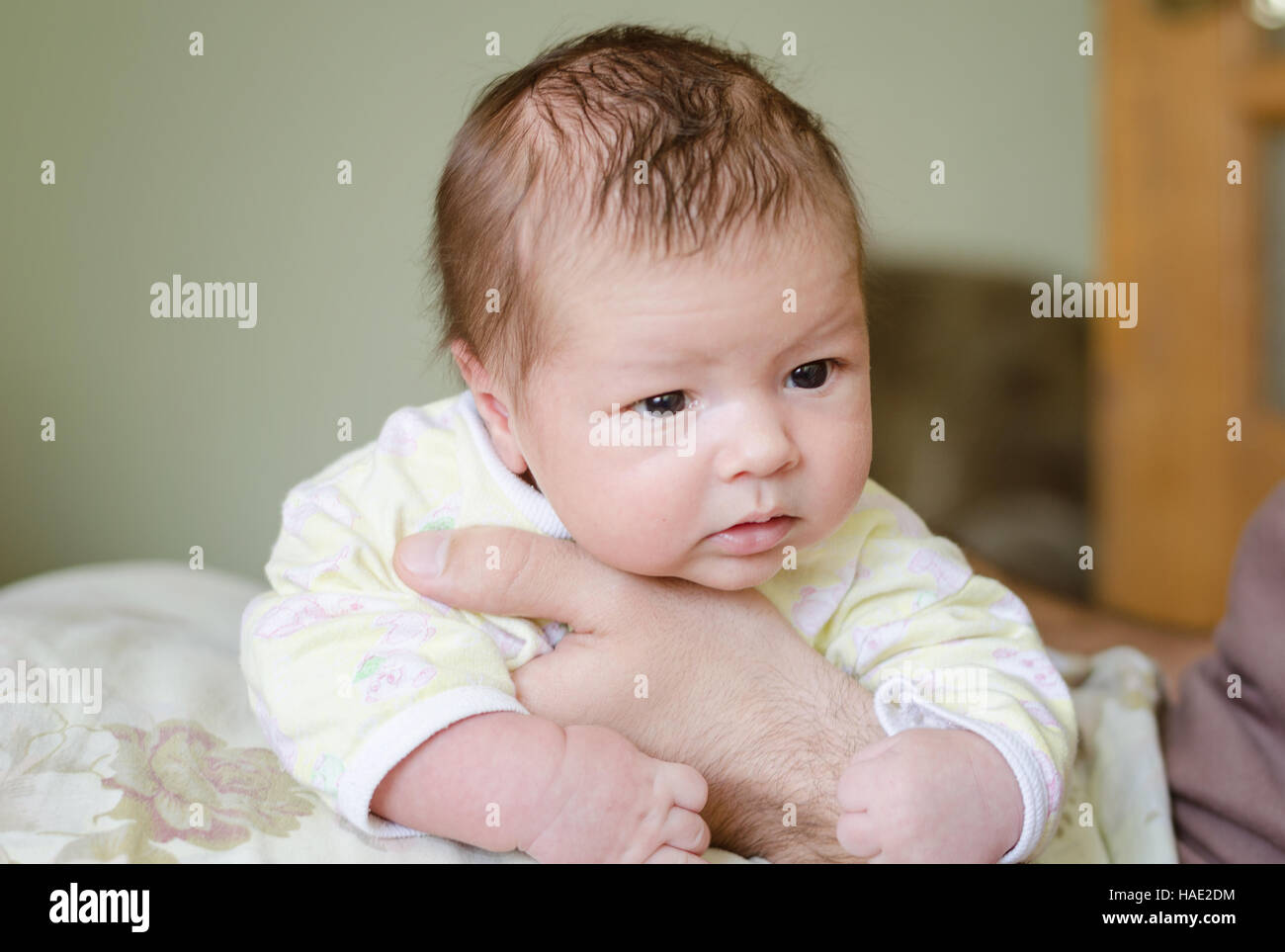 Portrait of a baby who is after awakening. Soft focus, warm light Stock ...