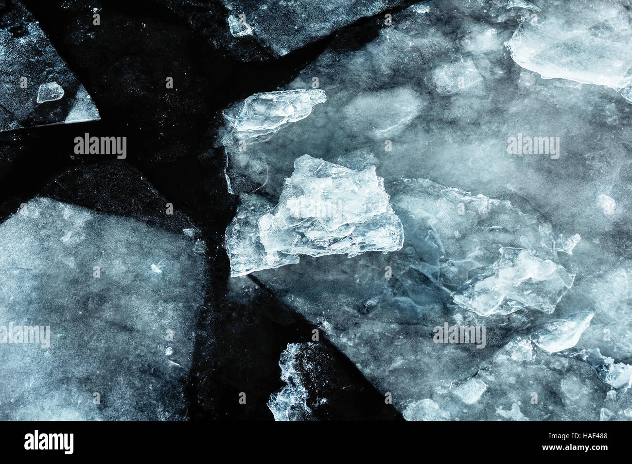 Nice ice in dark water at cloudy winter day Stock Photo - Alamy