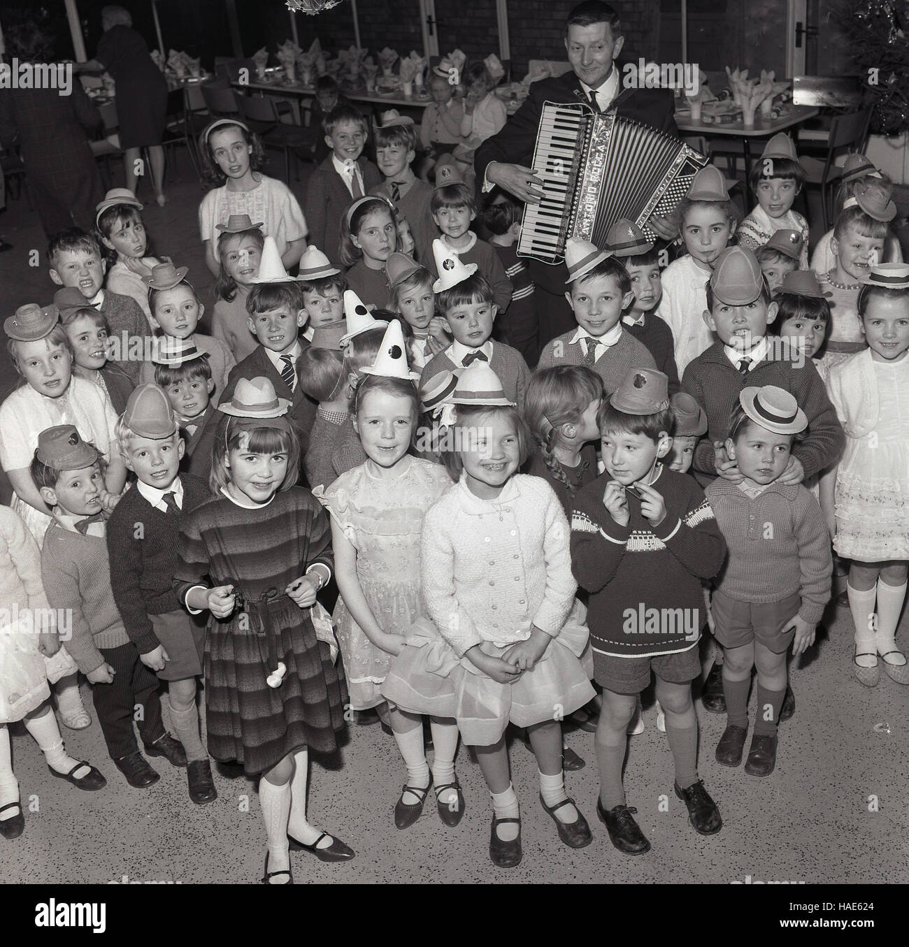 1965, historical, group of children wearing hats at a childrens party ...
