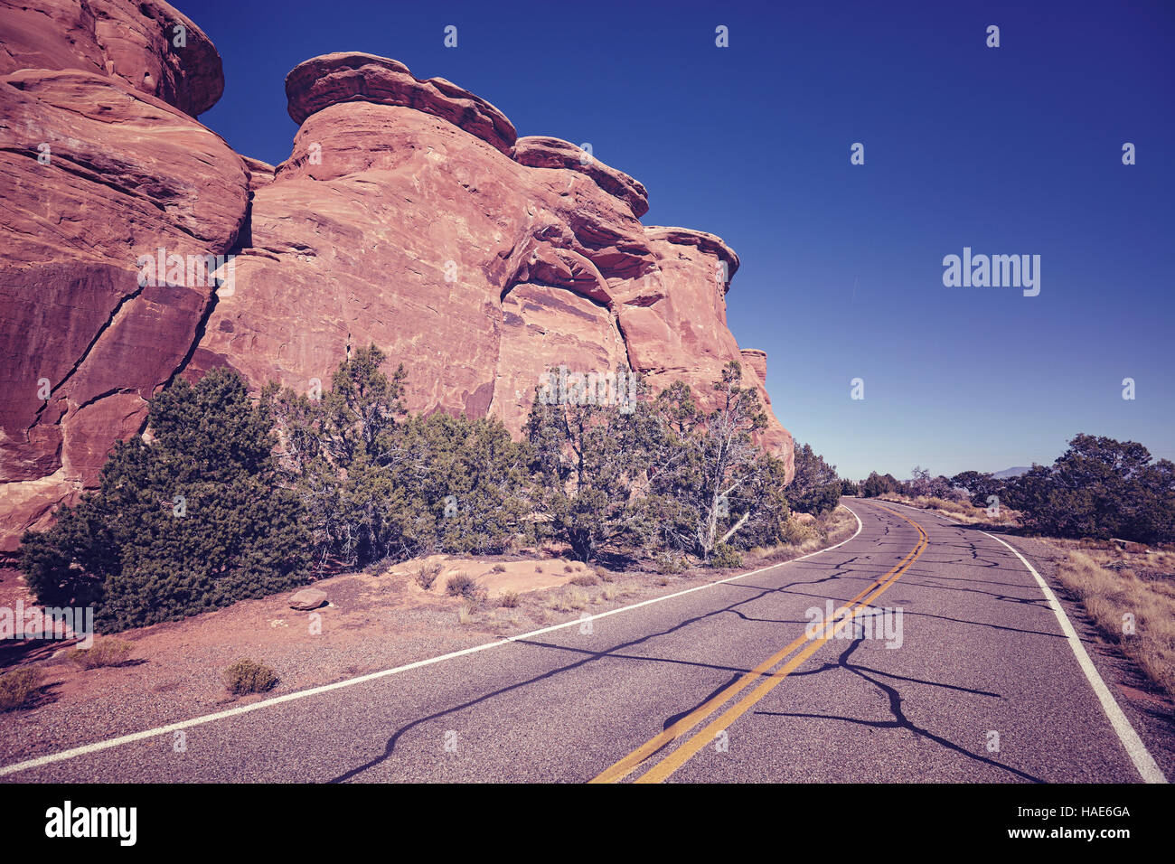 Retro toned scenic road, travel concept background, Colorado National ...