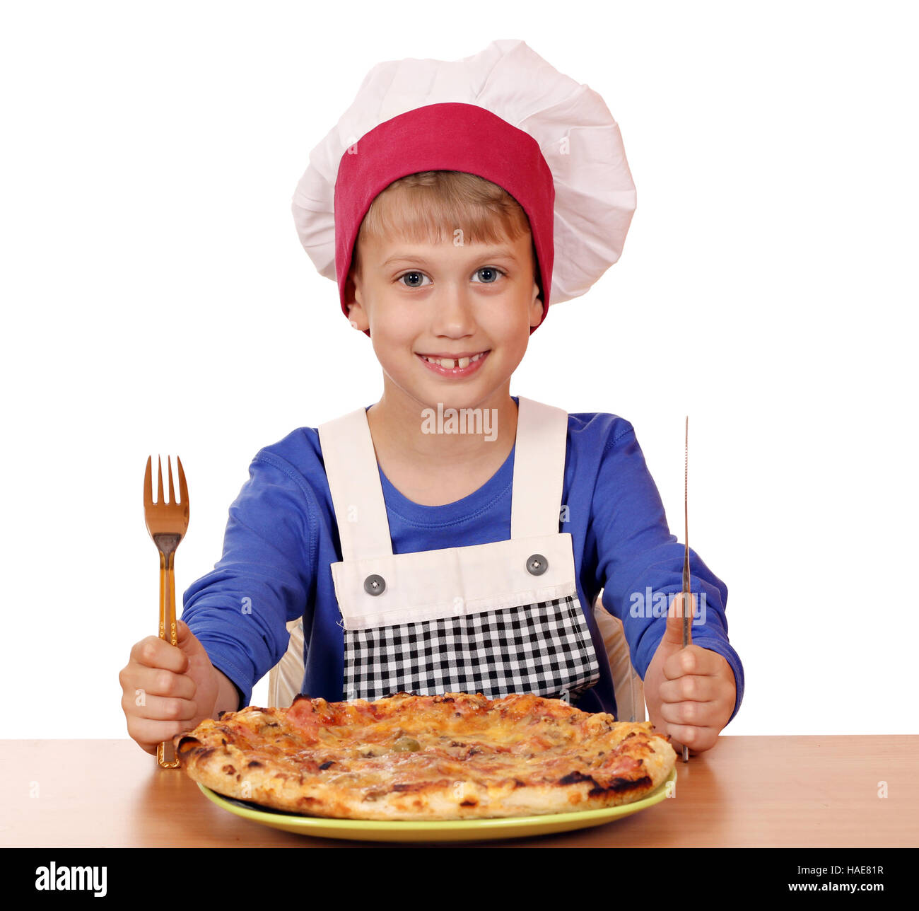 happy boy chef eat pizza Stock Photo - Alamy