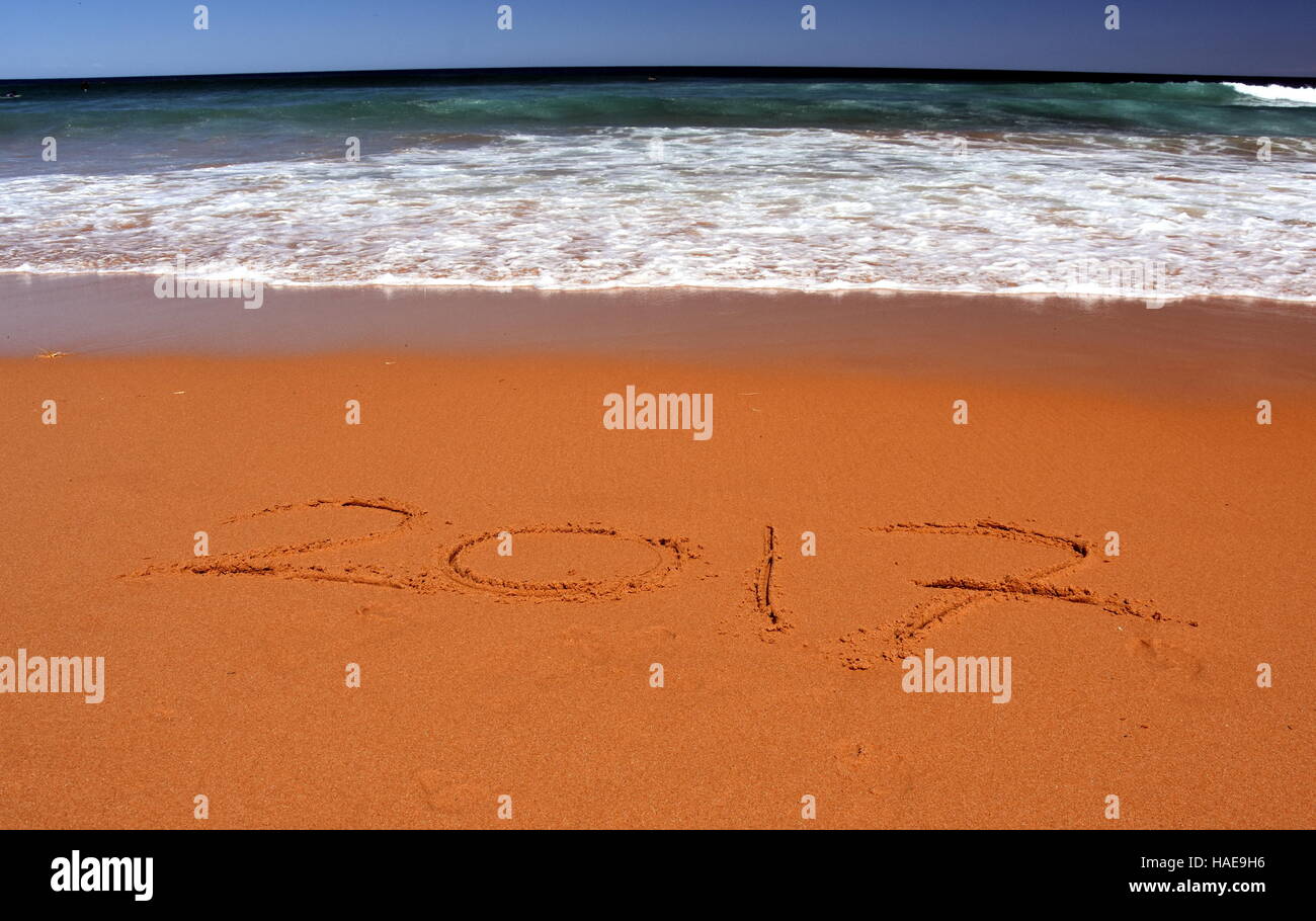 2017 written on sand at sunset. 2017 lettering on the beach. "2017 ...