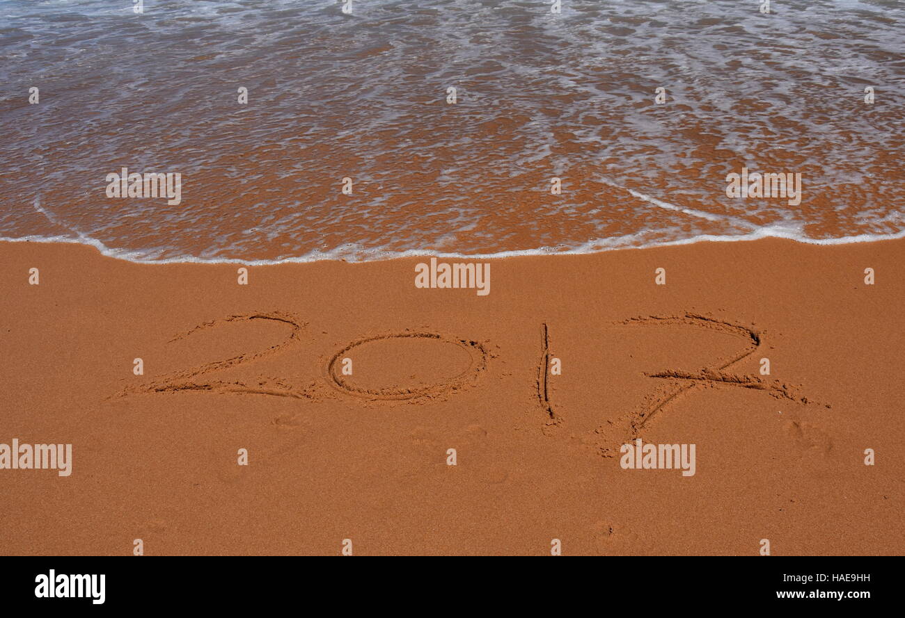 2017 written on sand at sunset. 2017 lettering on the beach. "2017 ...
