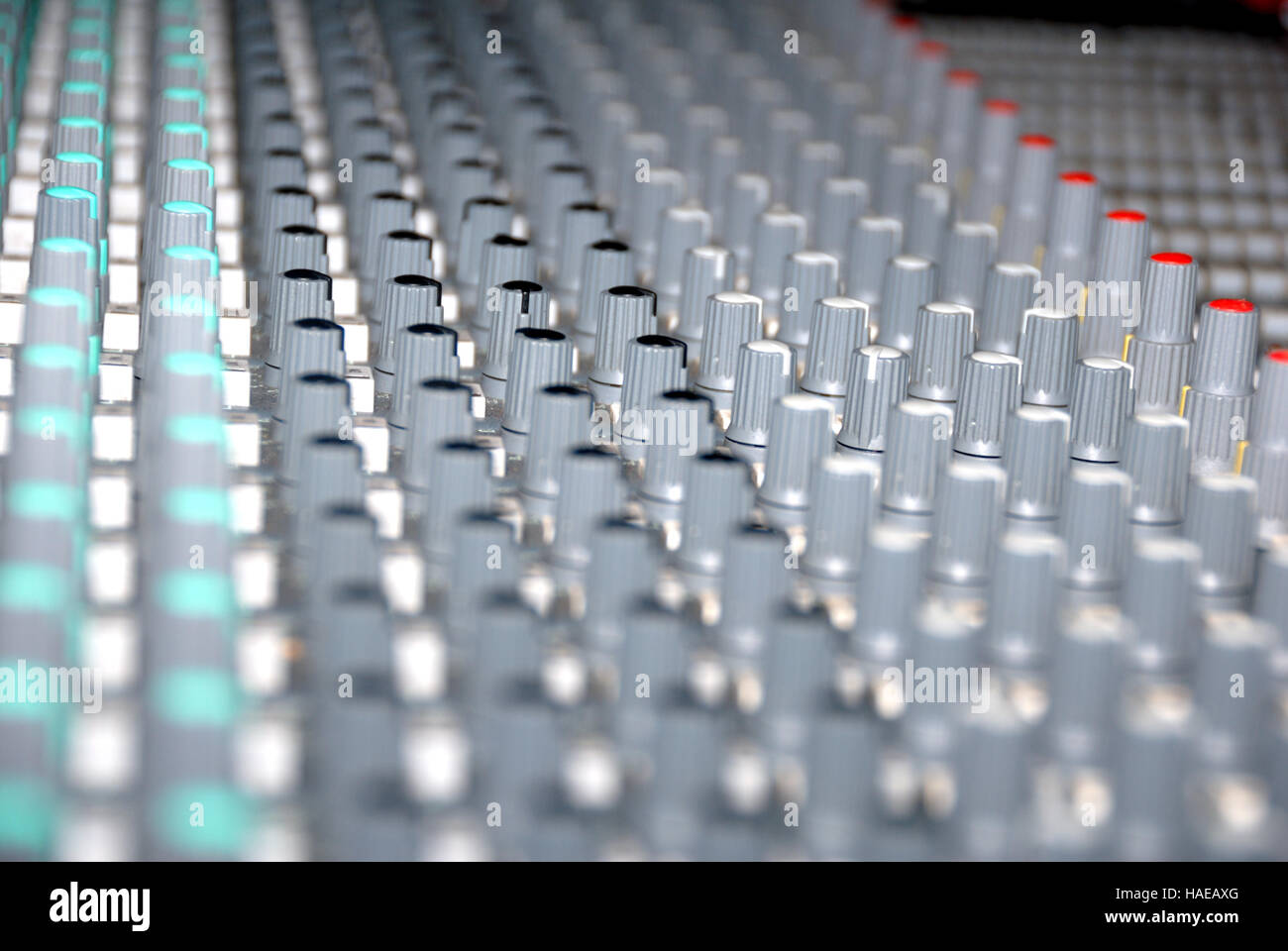 Audio mixing console in a recording studio. Faders and knobs of a sound ...