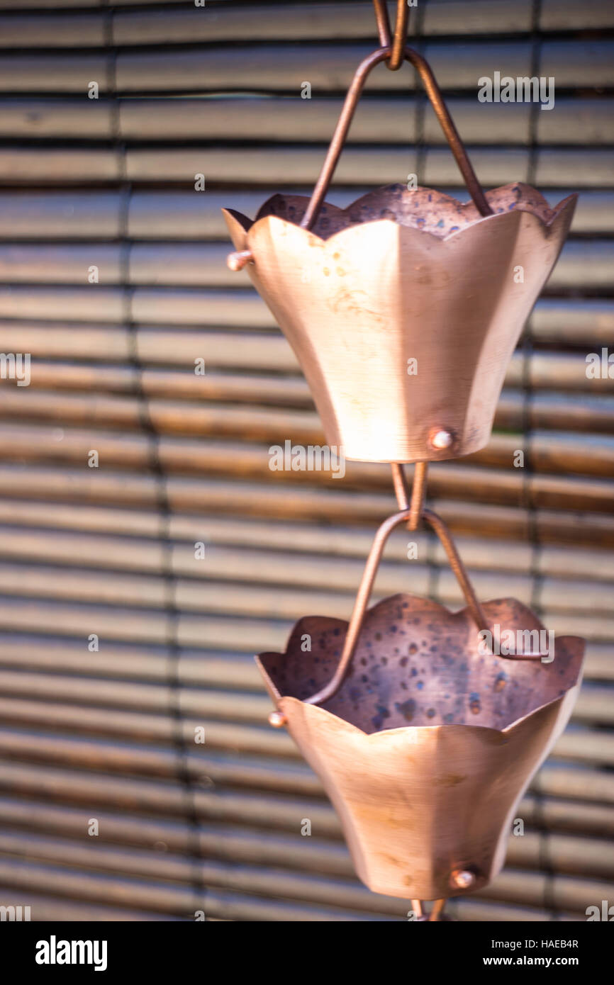 Vintage metallic bells used for rain waters way-out in zen garden ...
