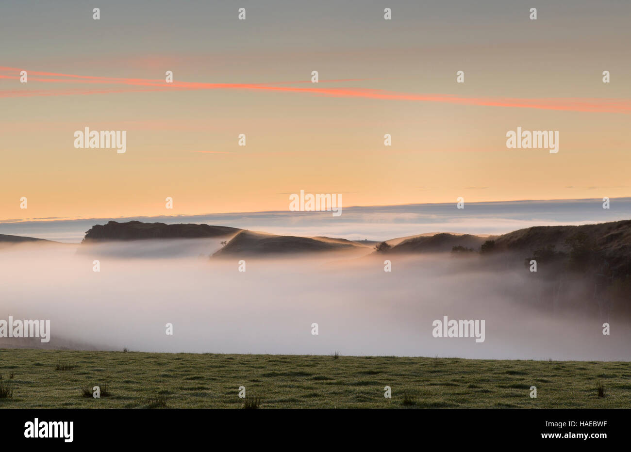 Beautiful low-lying mist at dawn below Peel Crags and Highshield Crags ...