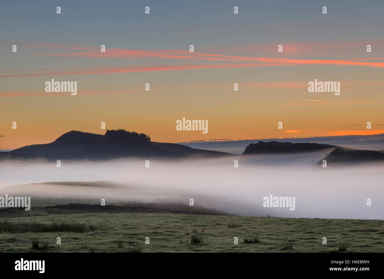Beautiful low-lying mist at dawn below Peel Crags and Highshield Crags ...