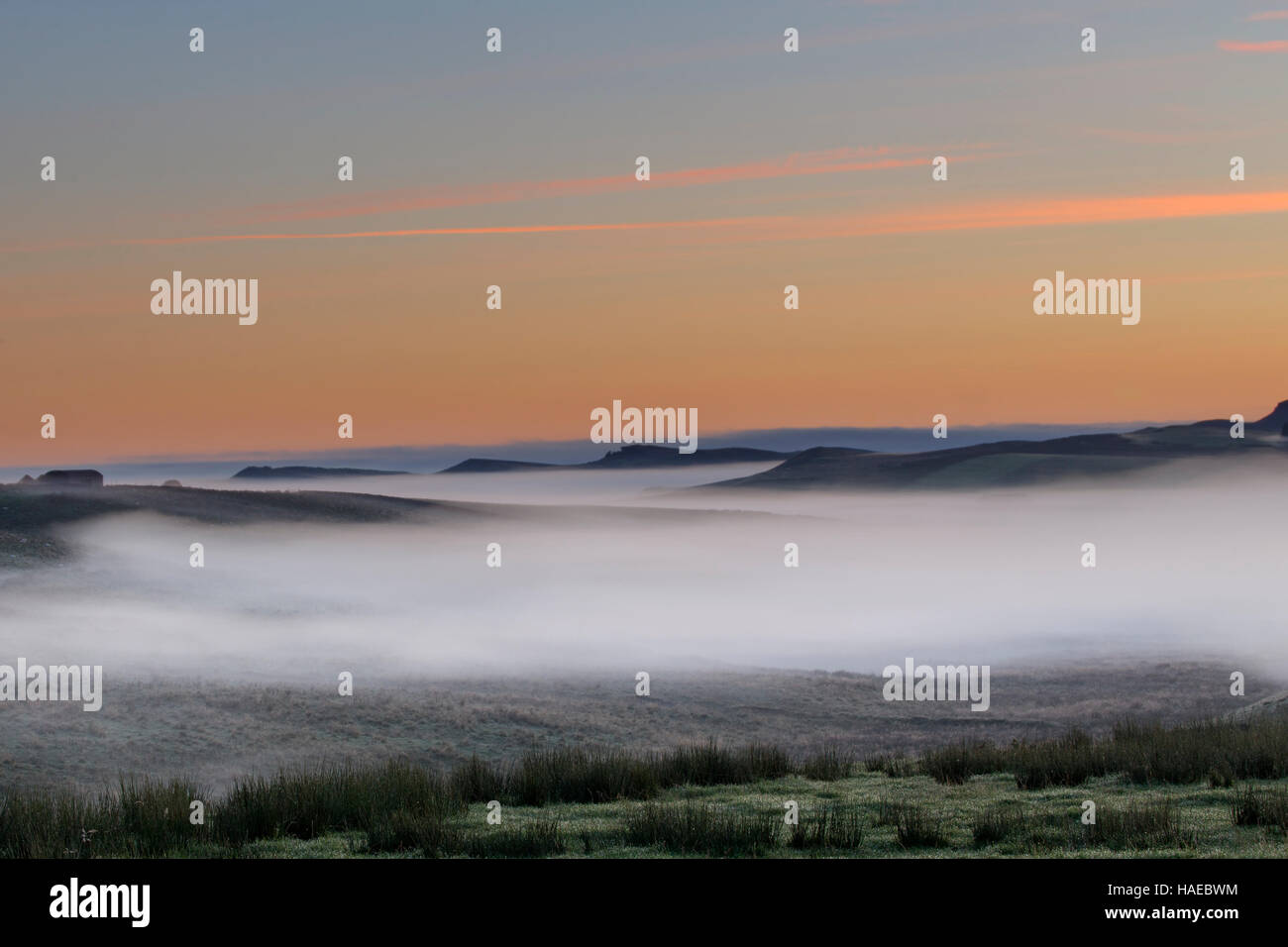 Beautiful low-lying mist at dawn below Peel Crags and Highshield Crags ...