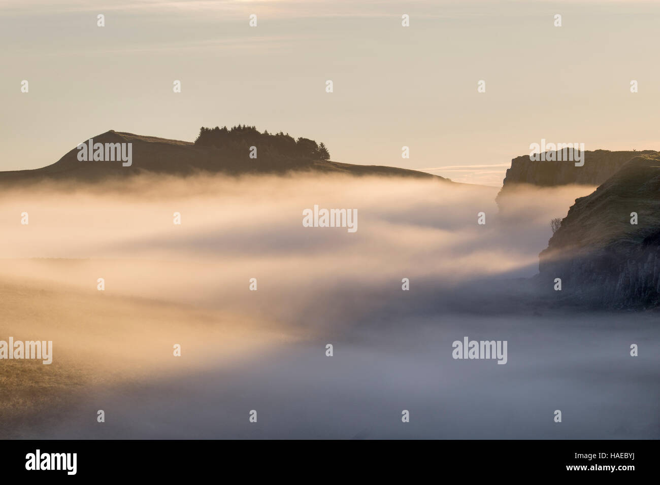 Beautiful low-lying mist at dawn below Peel Crags and Highshield Crags ...
