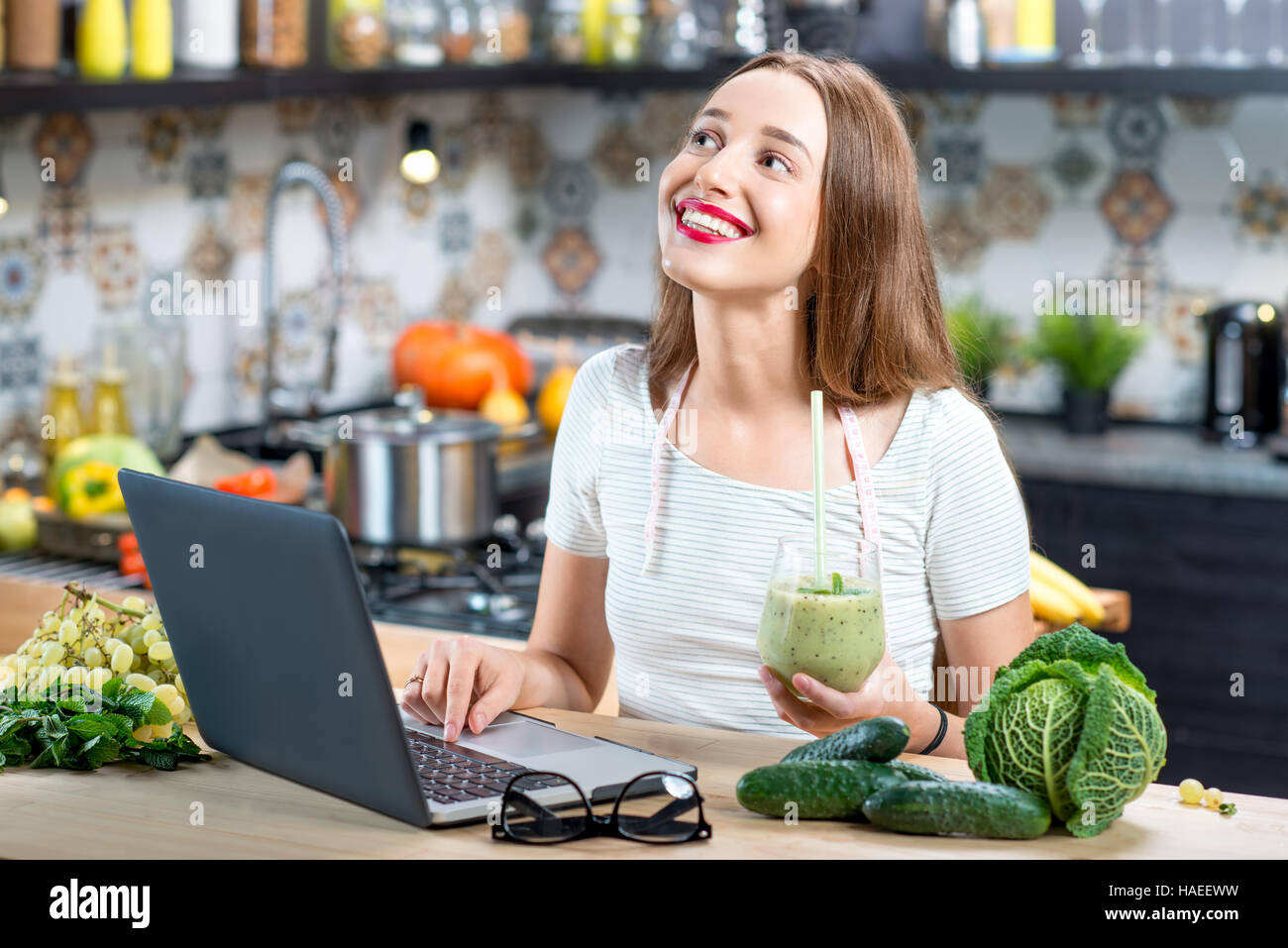 Woman with healthy food in the kitchen Stock Photo - Alamy
