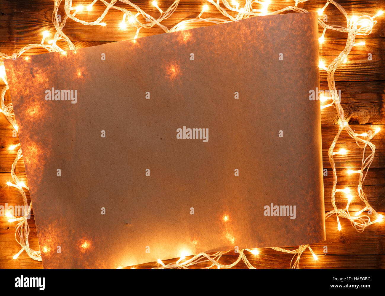 Empty space for Christmas compliments on paper with garland Stock Photo ...