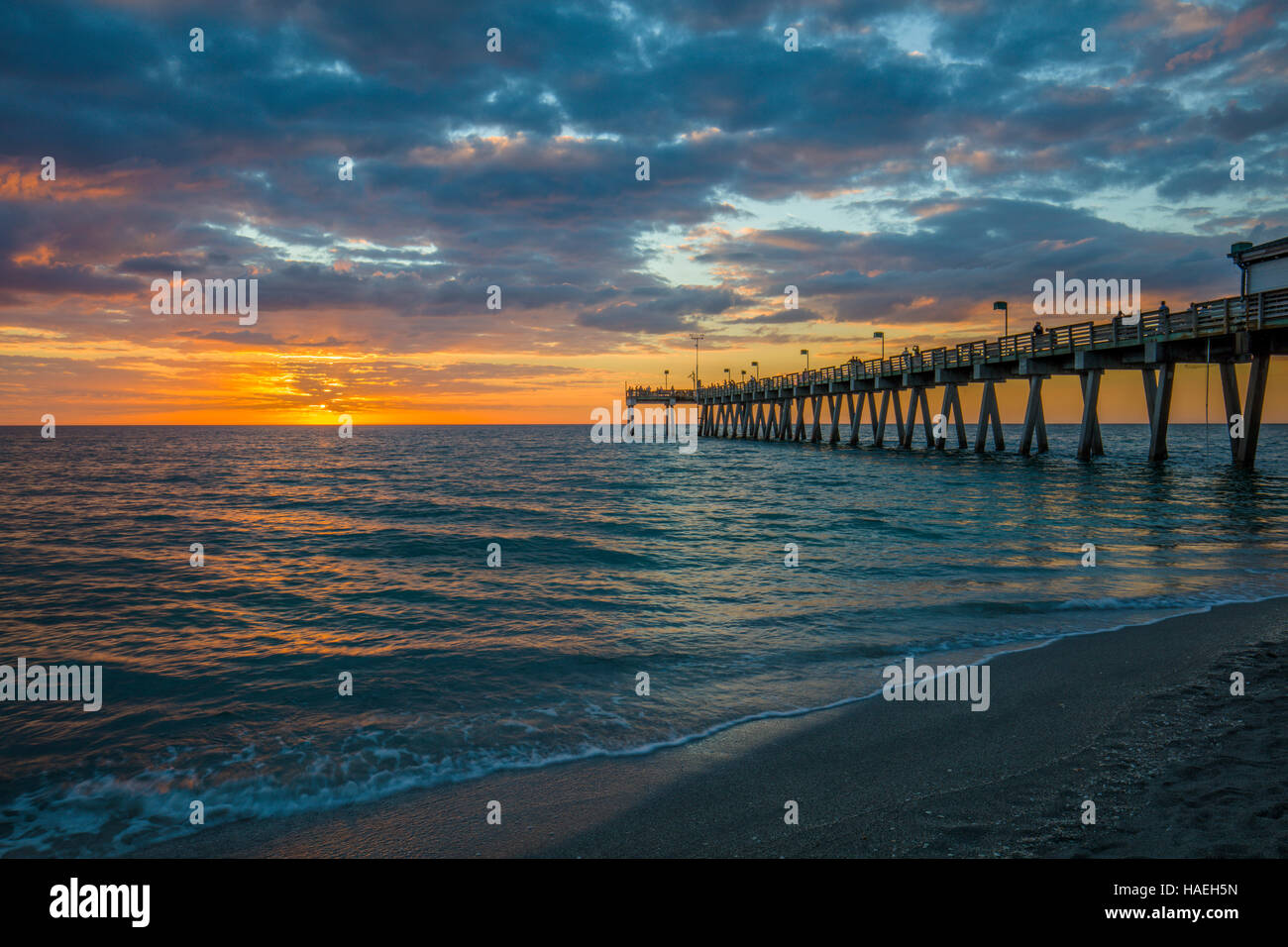 Sunset over Gulf of Mexico and Venice Pier from the beach in Venice on ...