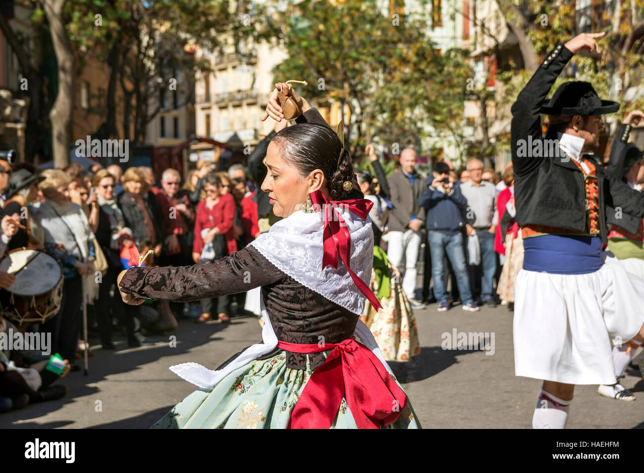 Man and women in local costumes,perform a traditional dance on Plaza ...